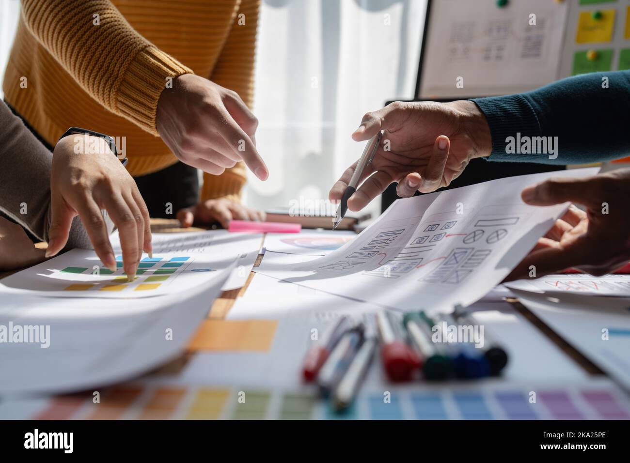 Group Of Ux Developer And Ui Designer Brainstorming About App Interface Design At Modern Office