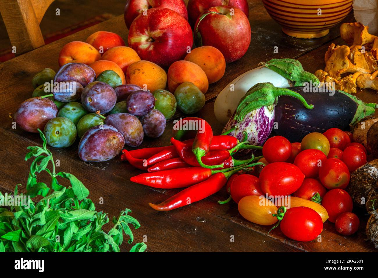 A still life view of fruit and vegetables, in the kitchen of a medieval ...