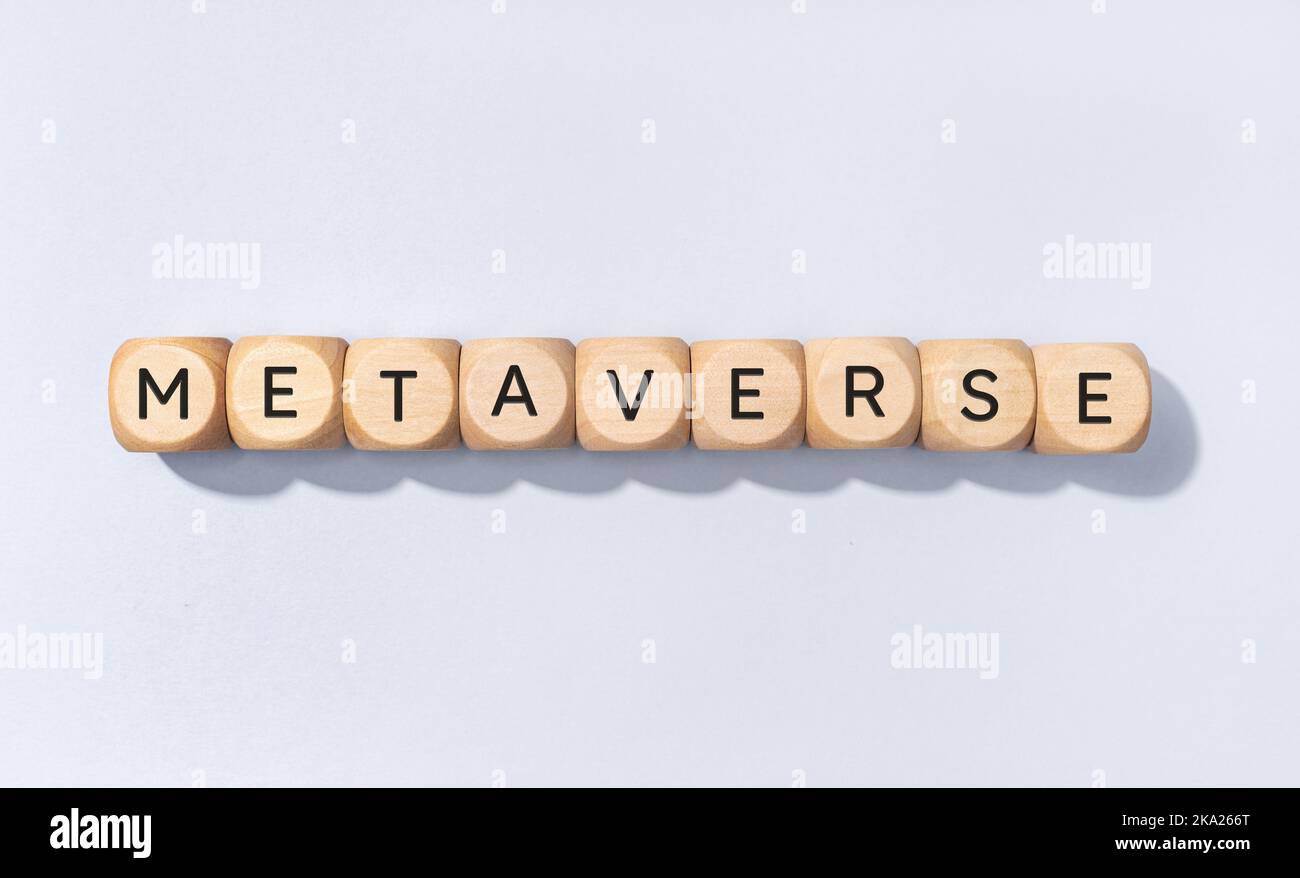 Metaverse word on wooden blocks on gray background Stock Photo - Alamy