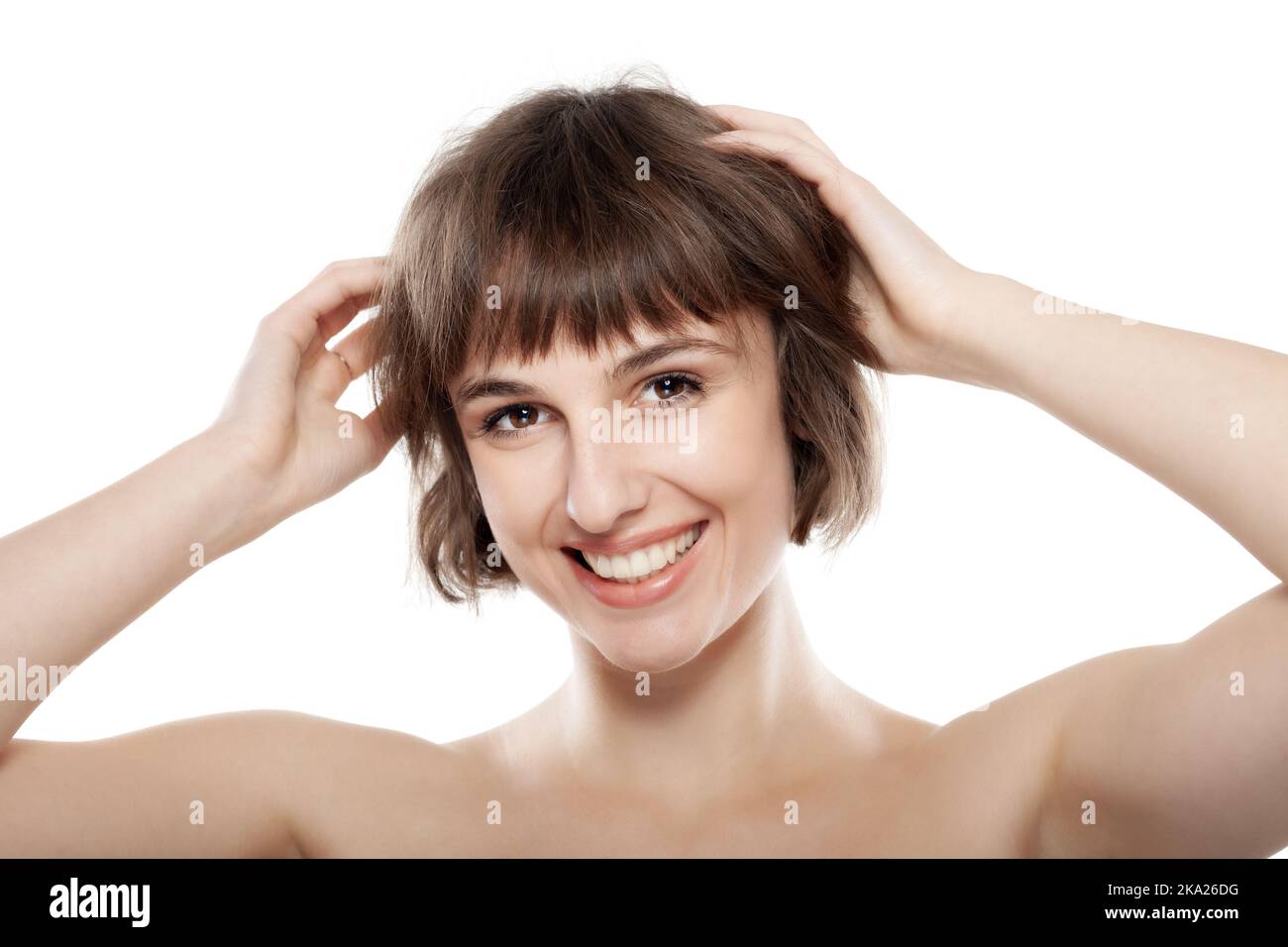 studio portrait of a beautiful brunette girl with short hair isolated ...