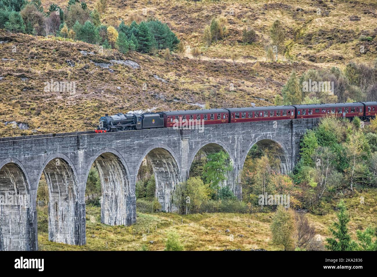 The Jacobite Scenic Steam Railway Passing Over The Glen Finnan Viaduct Headed By The Lms Class