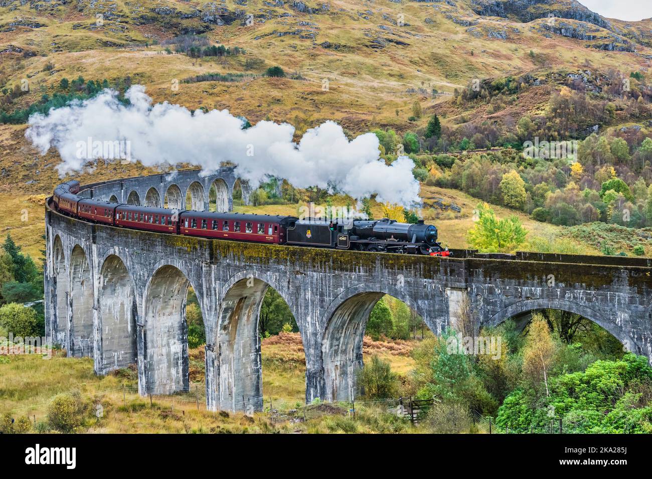 The Jacobite scenic steam railway passing over the Glen Finnan viaduct ...