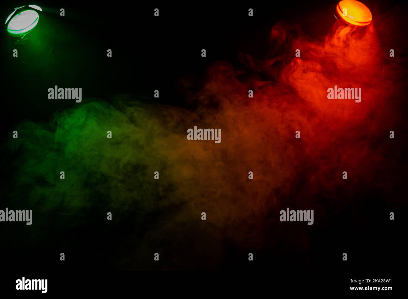 Red green smoke on a black background Stock Photo - Alamy