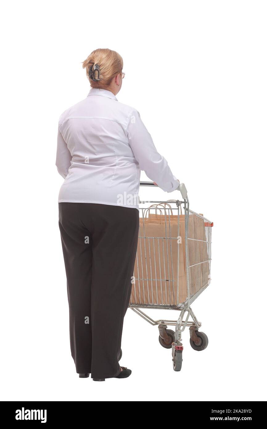 Rear view of casual woman with empty shopping cart on white background ...