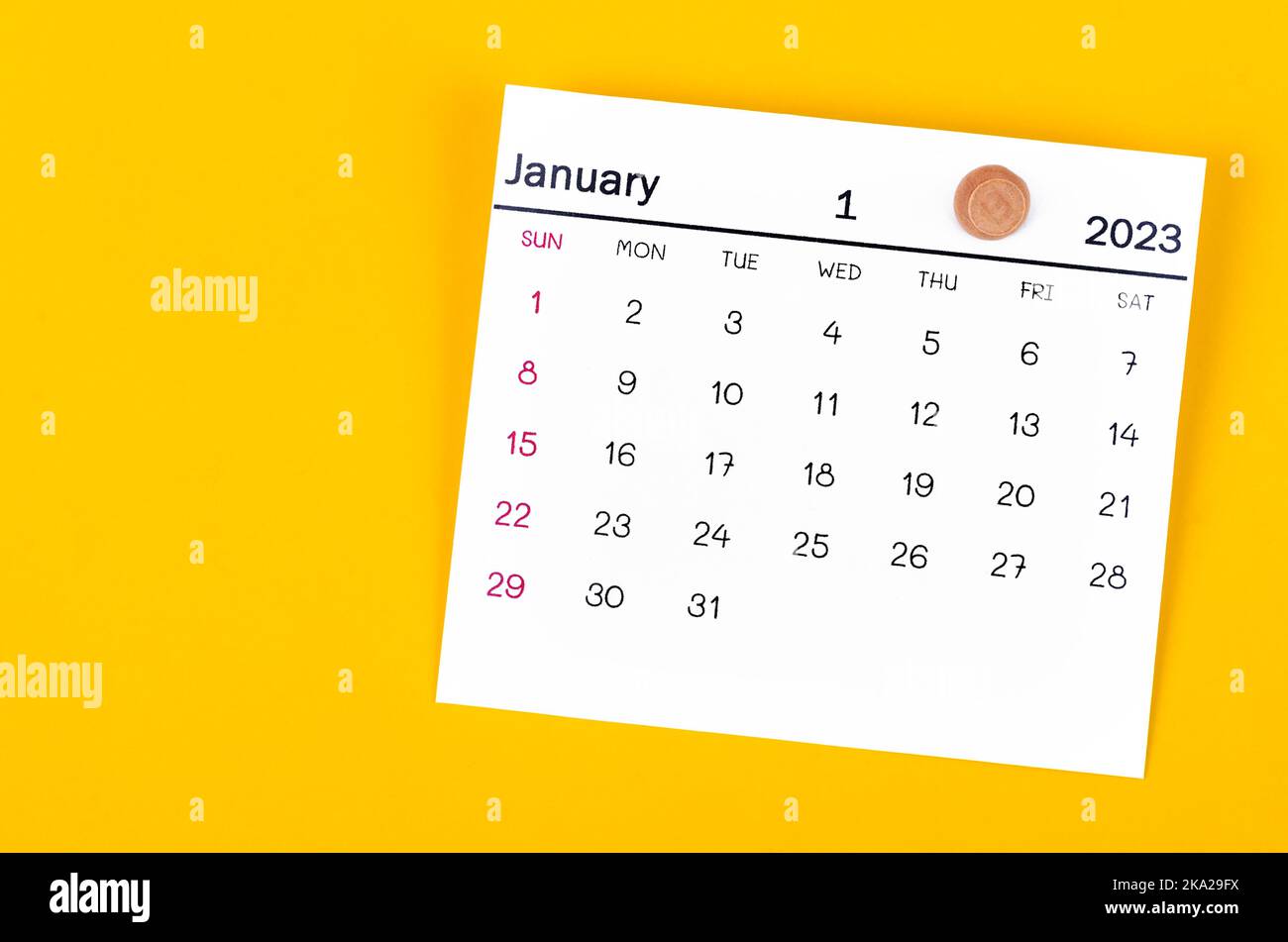 January 2023 and wooden push pin on yellow background Stock Photo - Alamy