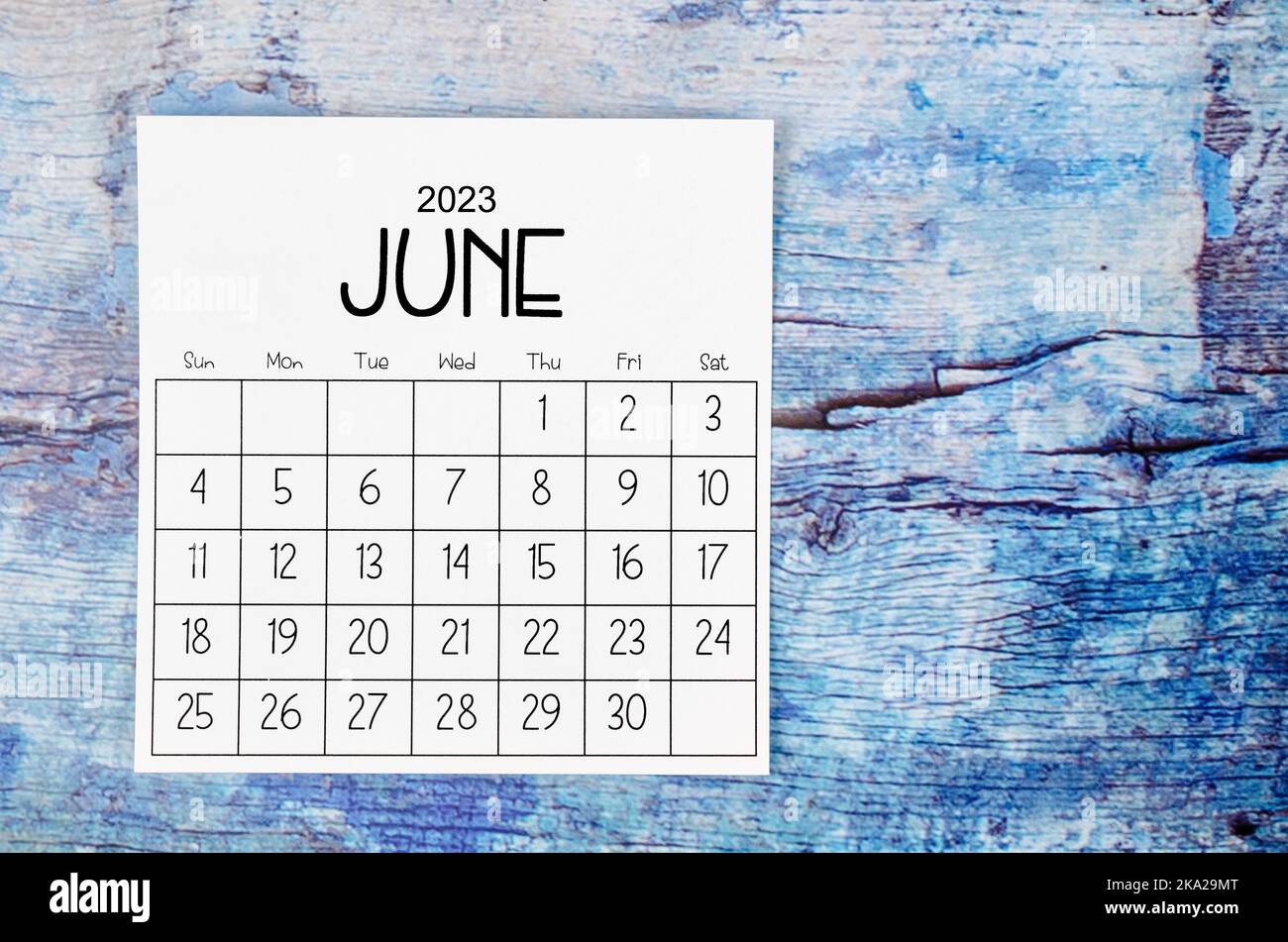 June 2023 Monthly calendar for 2023 year on old blue wooden background ...