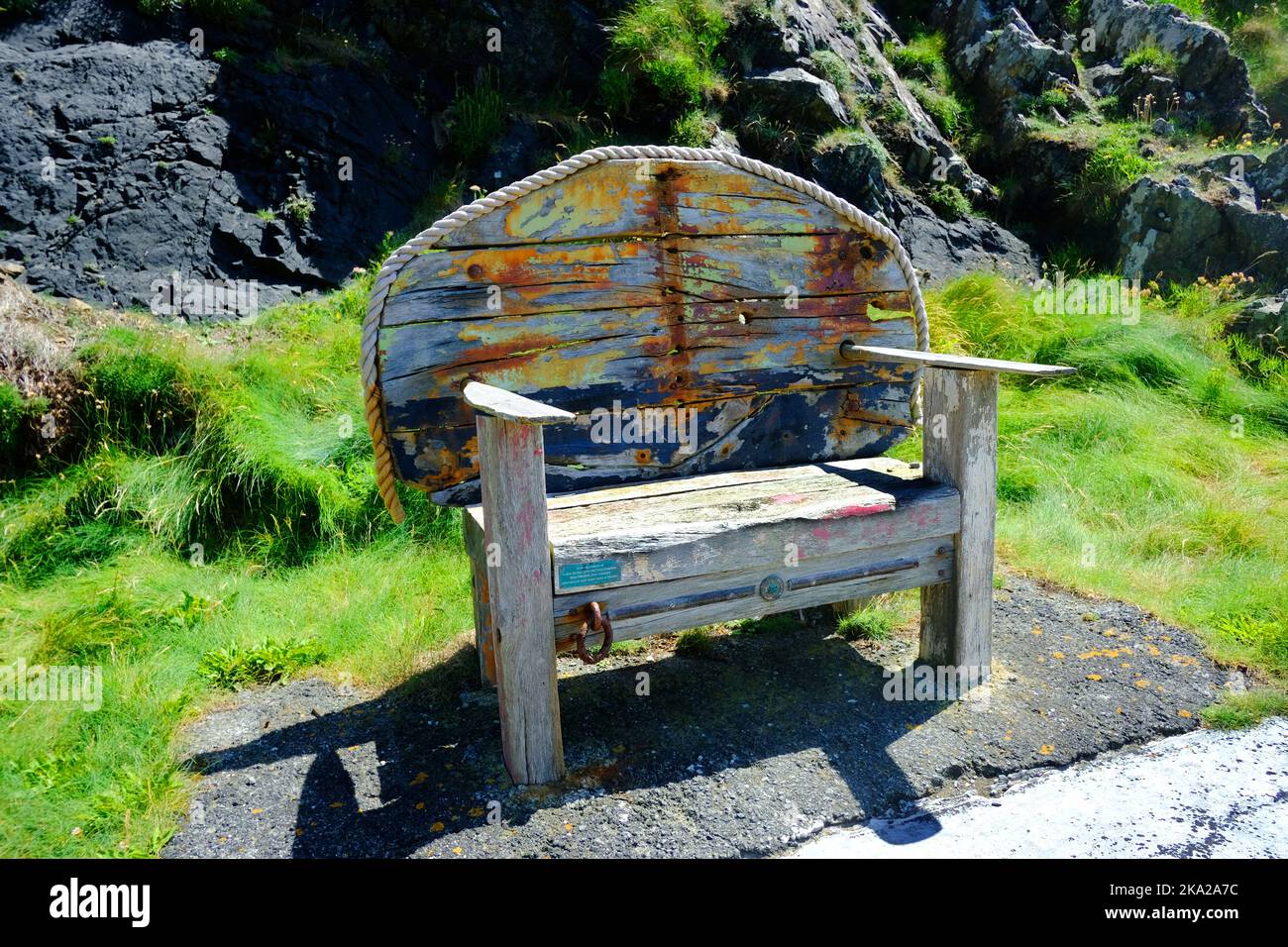 Handmade commemorative bench overlooking Mullion Cove, Cornwall, UK ...