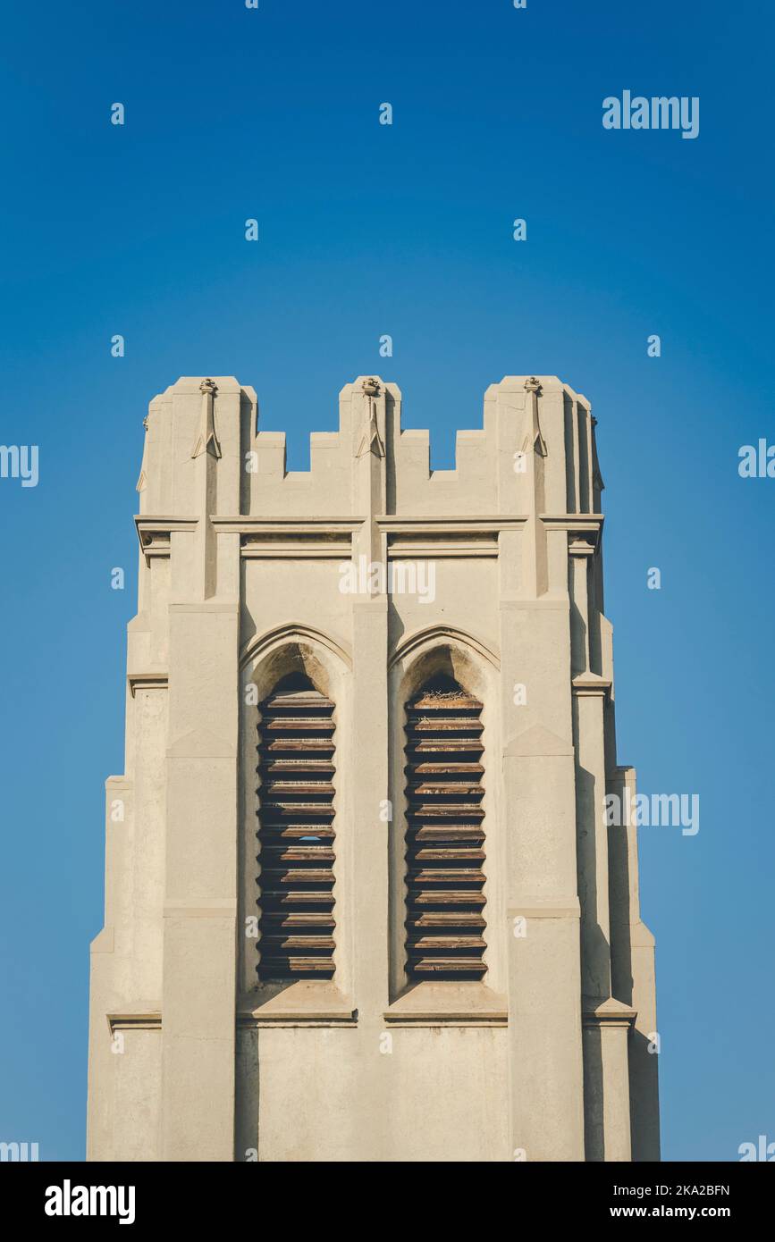 The top of an old tall tower with blue clear sky Stock Photo - Alamy