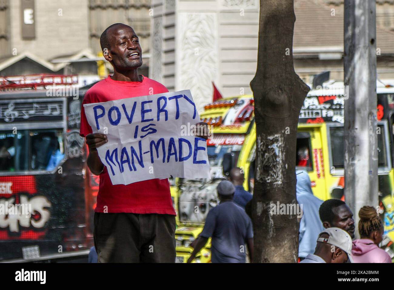Julius Kamau, a vocal Kenyan human rights activist speaks while holding ...