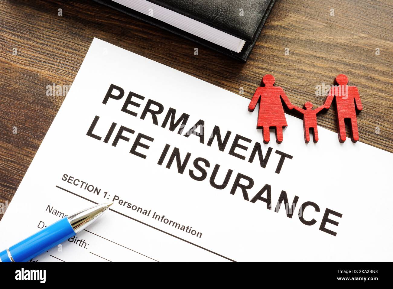 Permanent life insurance application and family figurine Stock Photo ...