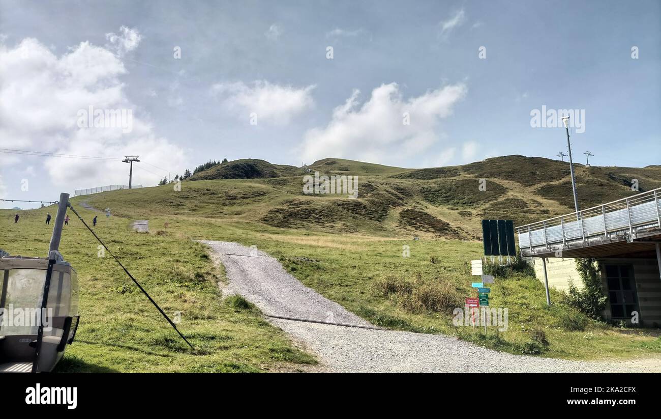 A gravel roads to the beautiful green hills Stock Photo - Alamy