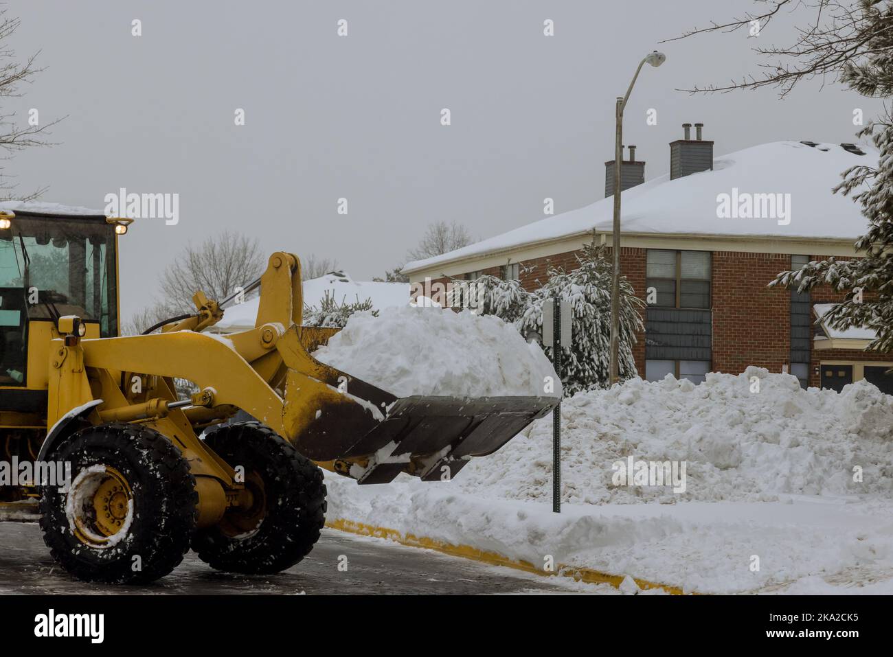 To remove snow from parking lot and road with truck it must be moved ...