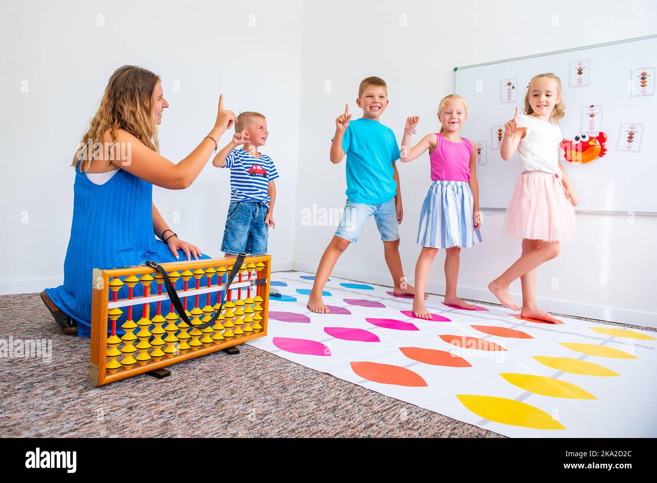 Child occupational therapy session. Group of children doing playful ...