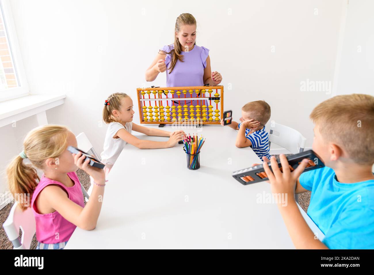 Child occupational therapy session. Group of children doing playful ...
