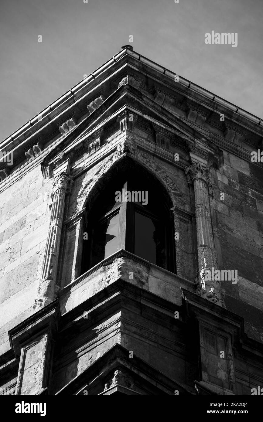 The vertical low-angle grayscale of a medieval buildings exterior Stock ...