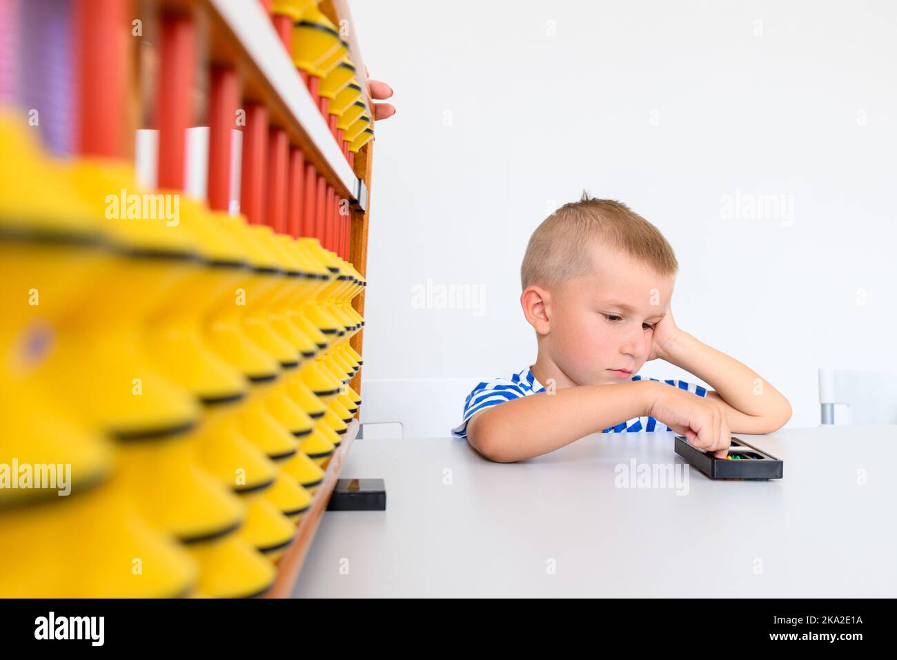 Child with learning difficulty in occupational therapy. A boy doing ...