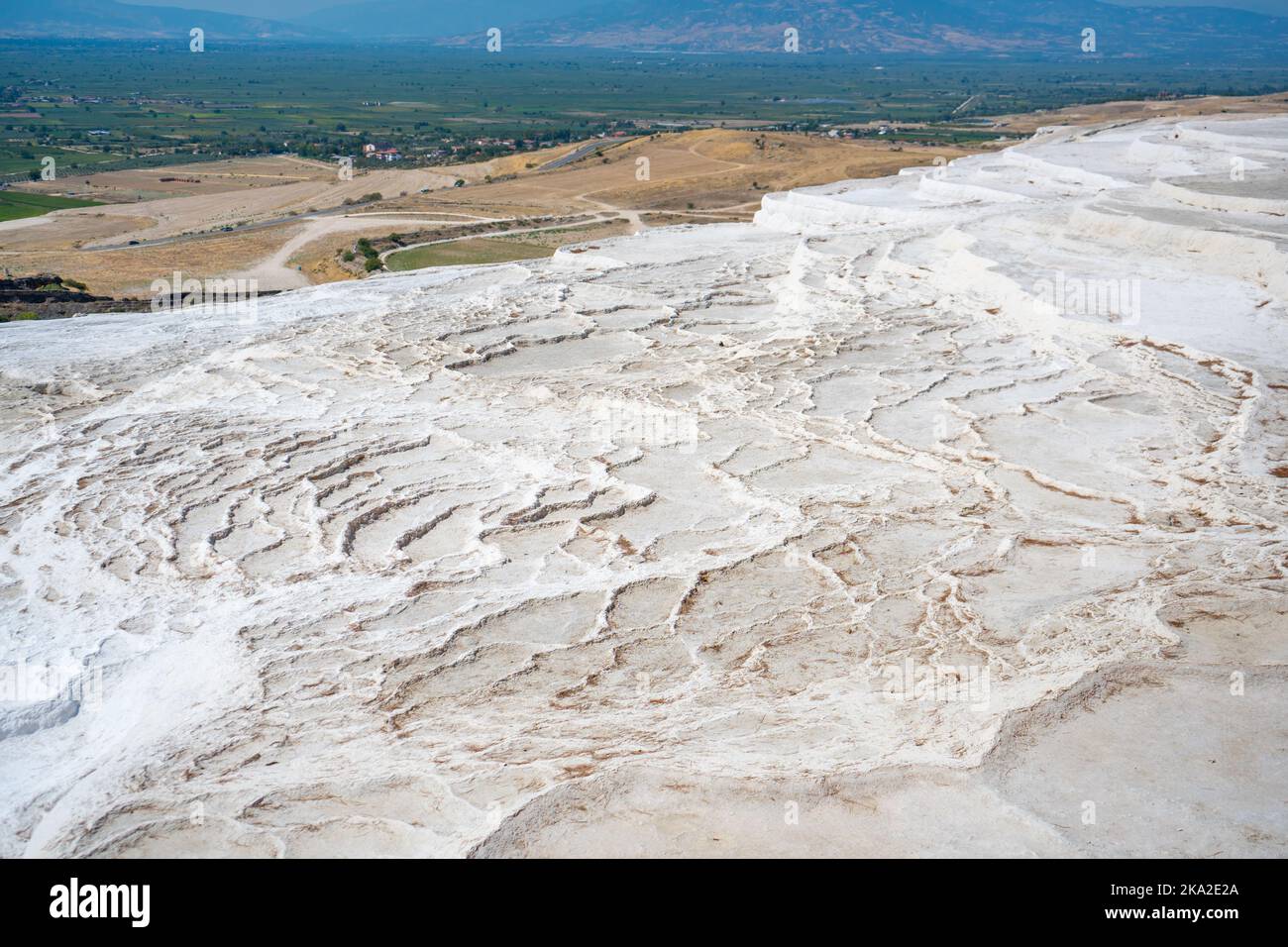 Calcite cliff of Pamukkale, white travertines in Turkey Stock Photo - Alamy