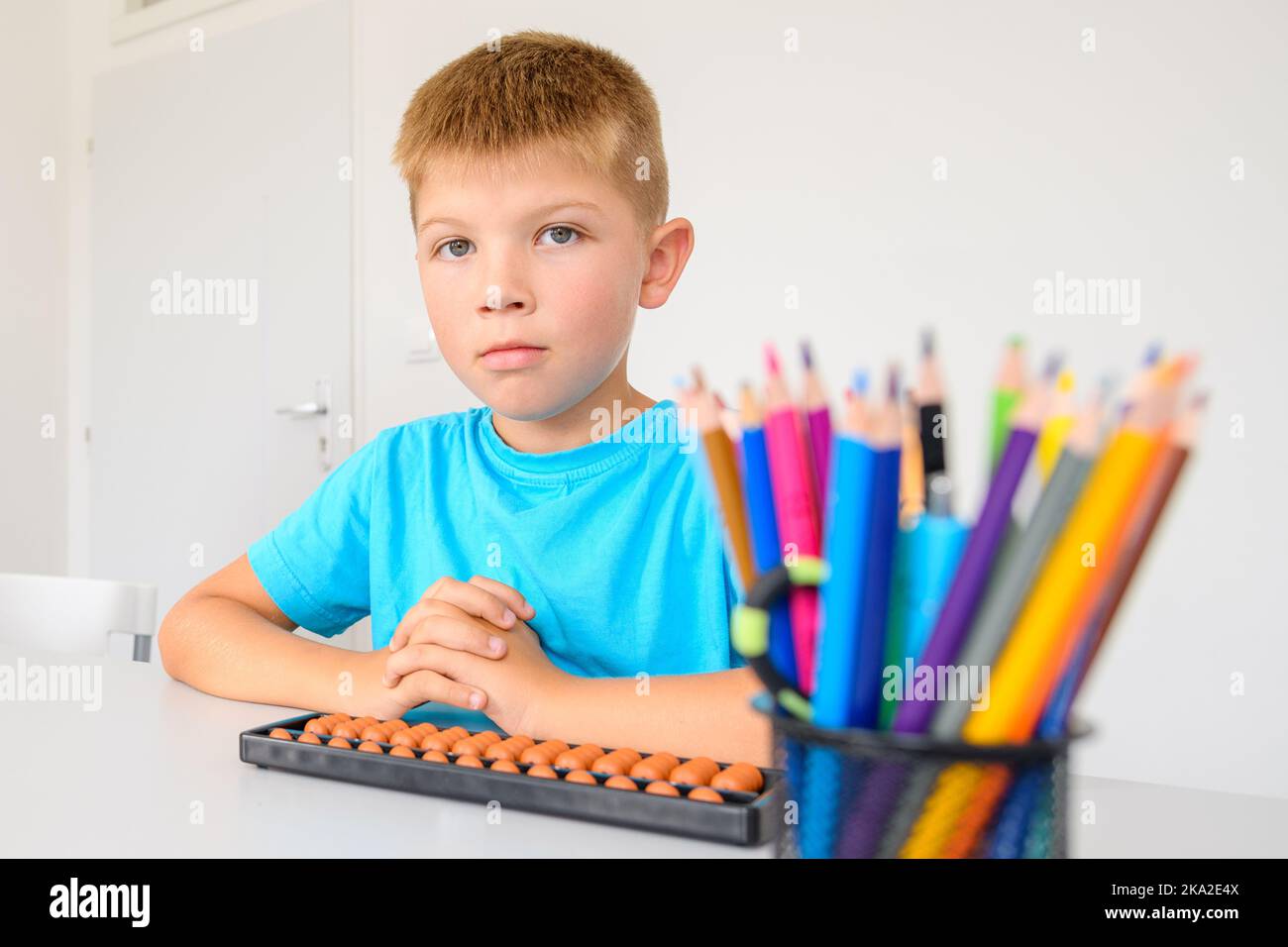 Child with learning difficulty in occupational therapy. A boy doing ...