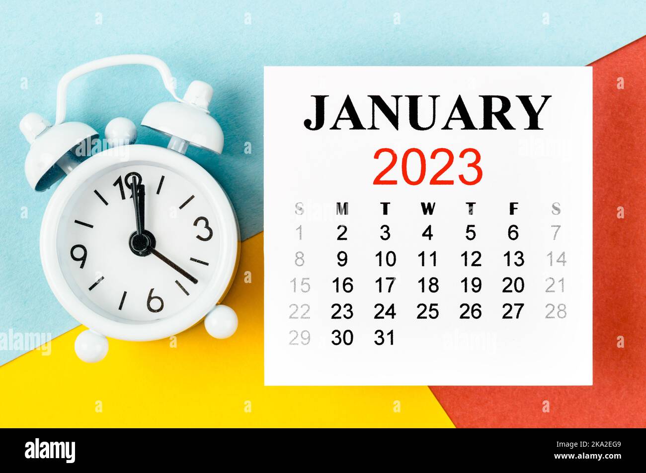 January 2023 Monthly calendar year with alarm clock on colourful ...