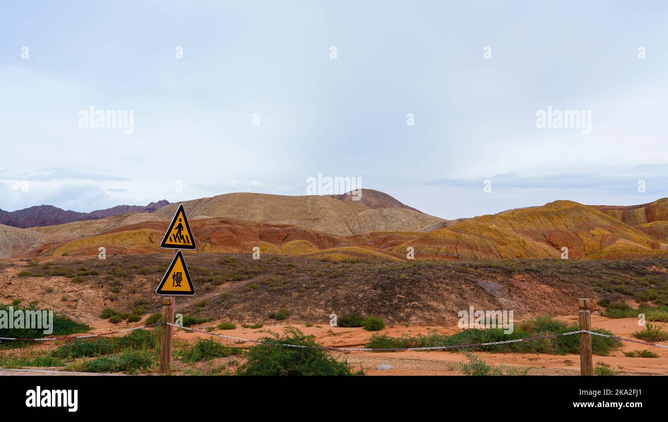 The road sign post captured against the landforms in Zhangye national ...