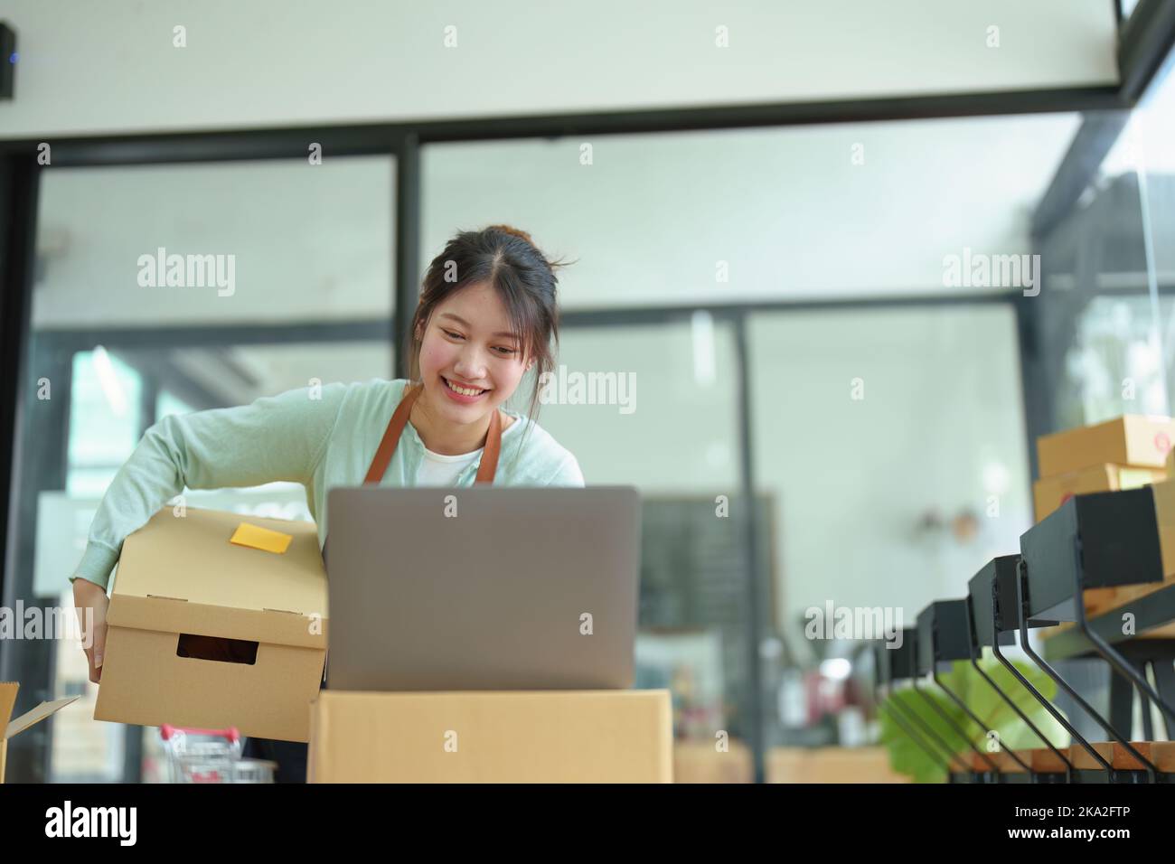 A portrait of a small startup, an SME owner, an Asian female ...