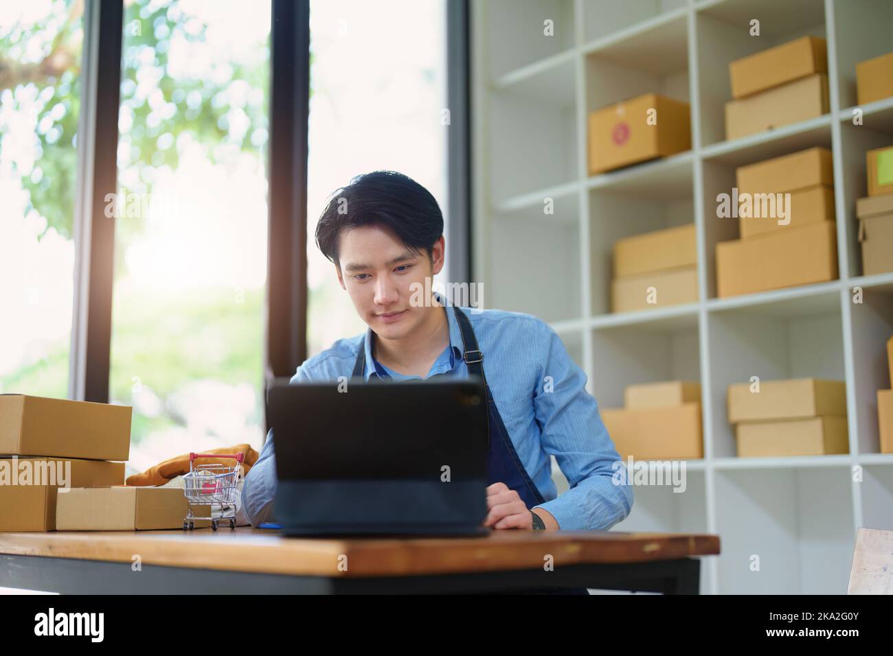 Picture of a small start-up and SME owner, an Asian male entrepreneur ...