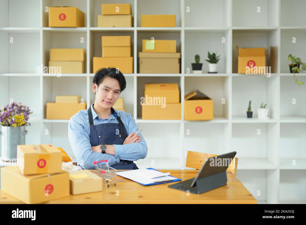 Picture of a small start-up and SME owner, an Asian male entrepreneur ...