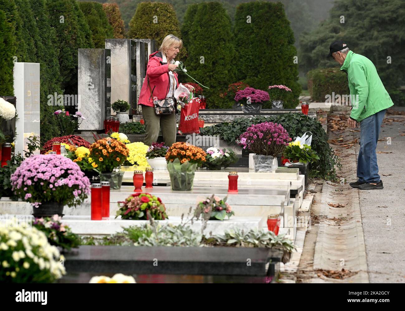 Zagreb, Croatia. 31st Oct, 2022. People visit the graves of their loved ...