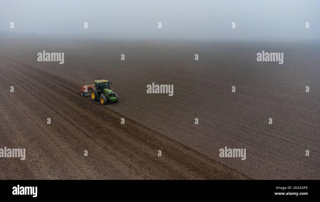 Aerial view of a wheat field shrouded in fog. In Slavonia, the last ...