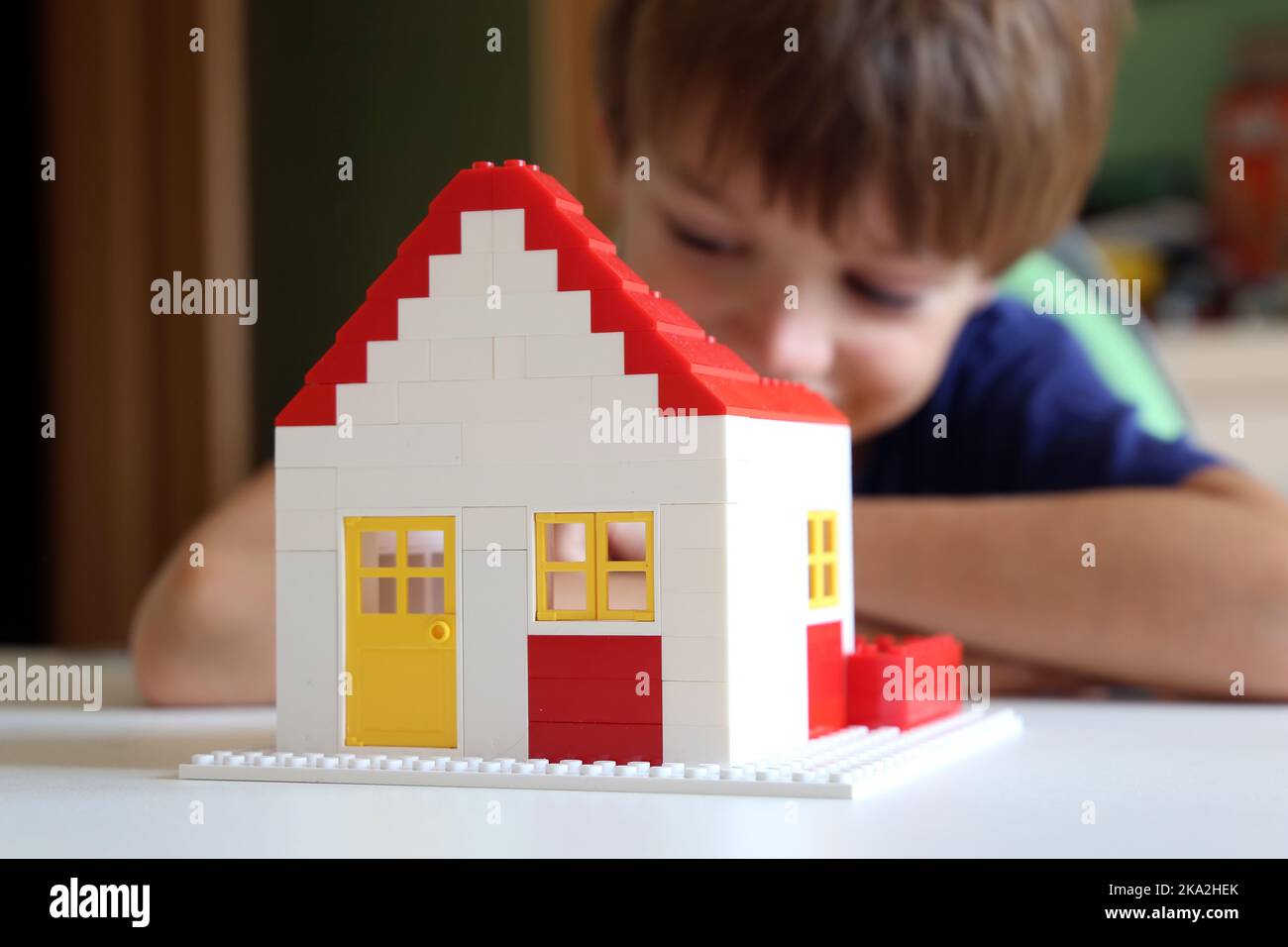 Symbol image: Boy builds a house with building blocks (Model released ...
