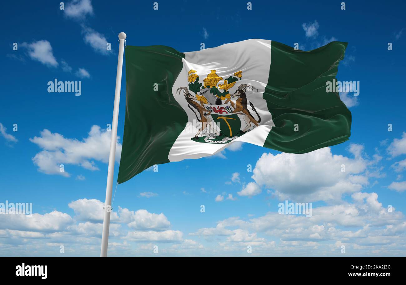 flag of Rhodesia 1968 1979, africa at cloudy sky background, panoramic ...