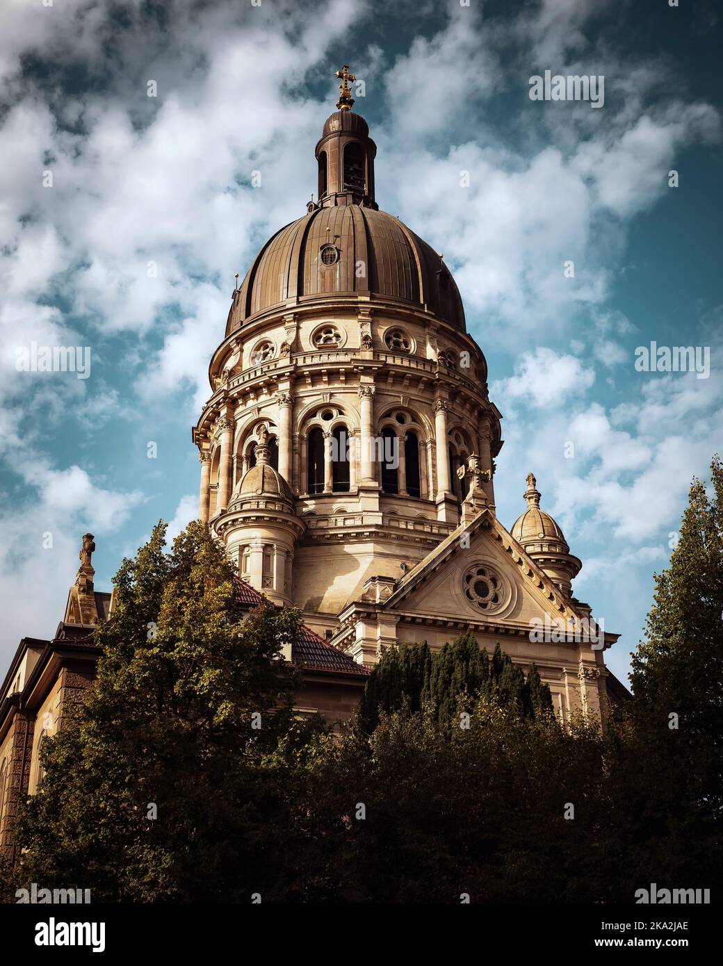 An outdoor view of an old church under a cloudy blue sky Stock Photo ...
