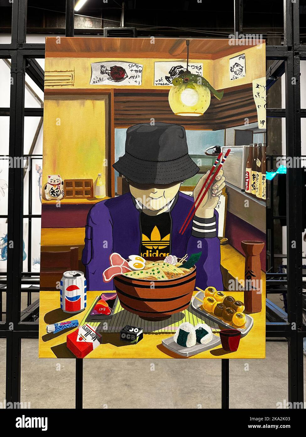 A vertical closeup of an artwork on display at Diploma Exhibition in ...