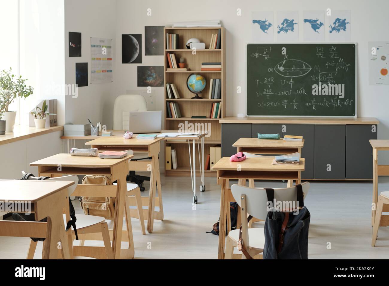 Empty classroom of algebra or physics subject with formulas written on ...