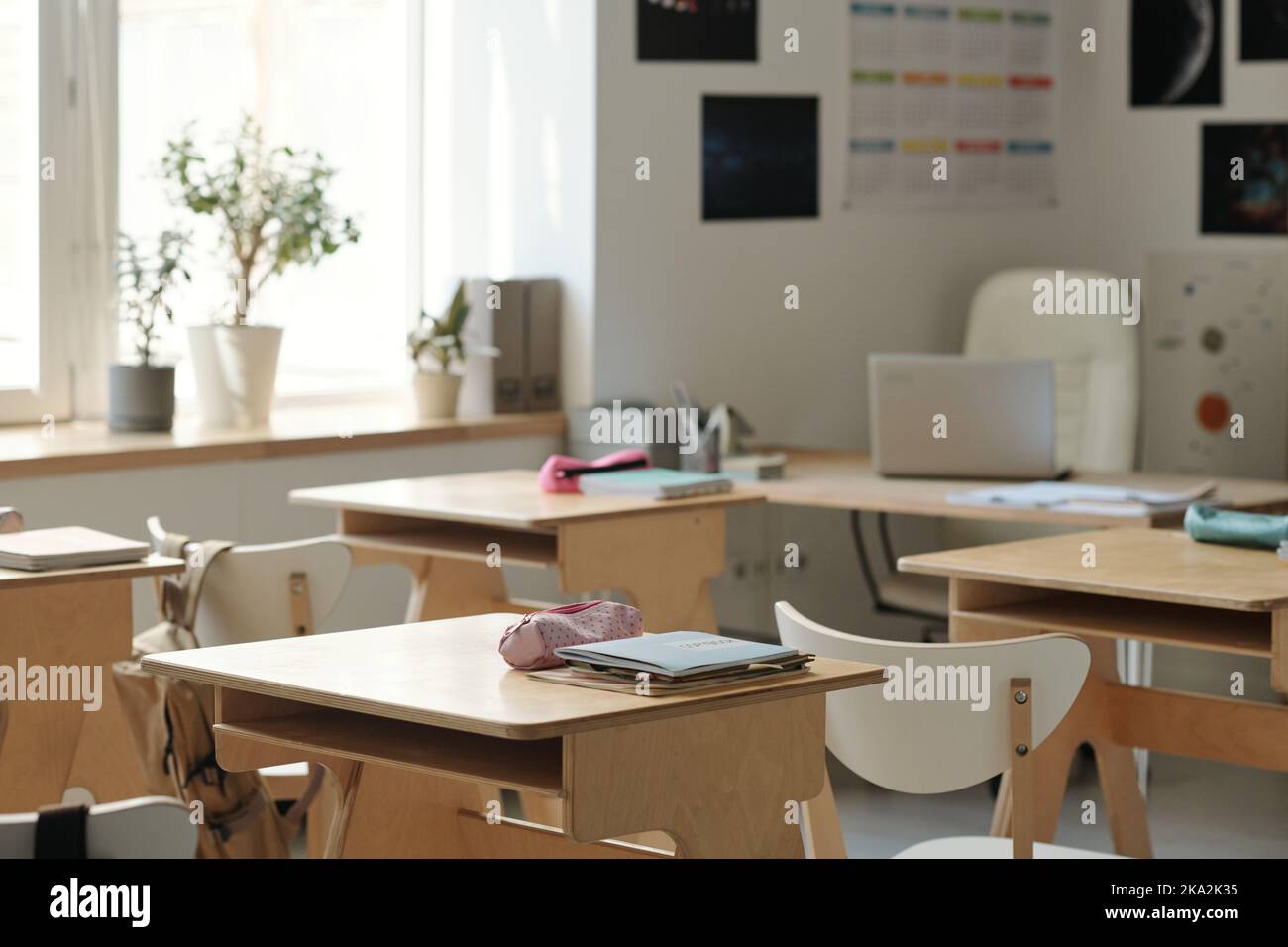 Part of spacious classroom in modern elementary school with group of ...