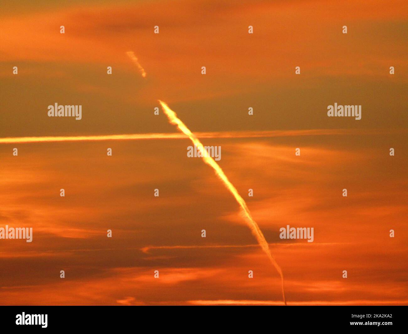 A closeup of the glowing light trails captured at sunset in an orange ...