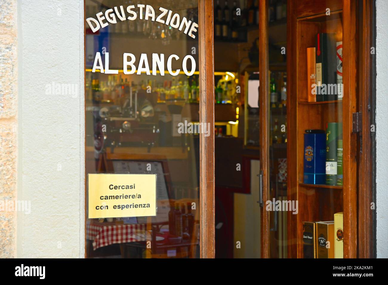 An experienced waiter hiring sign on display at restaurant window in ...