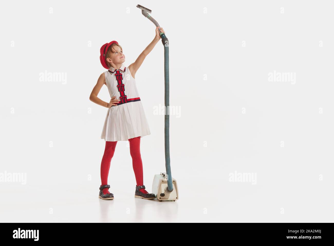 Housemaid. Little cute stylish girl, kid in retro fashion outfit with ...