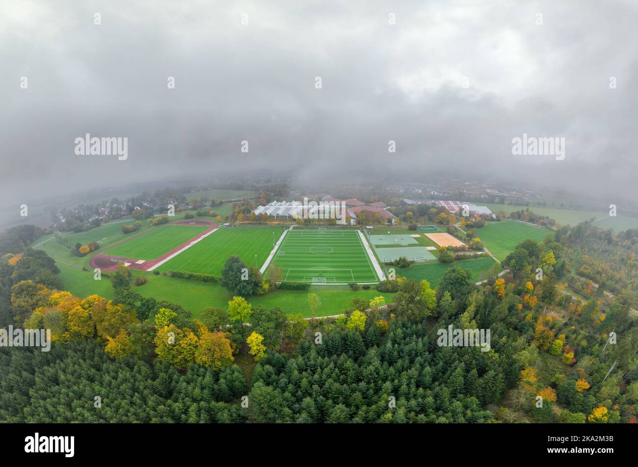 The green grass field of football field in the fog hi-res stock ...