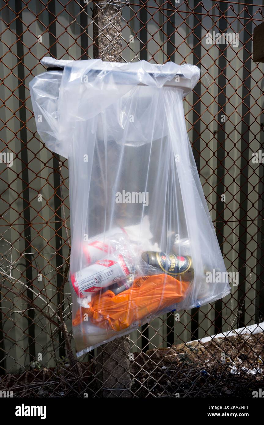 Rubbish in a litter bin on a railway station platform in England Stock ...