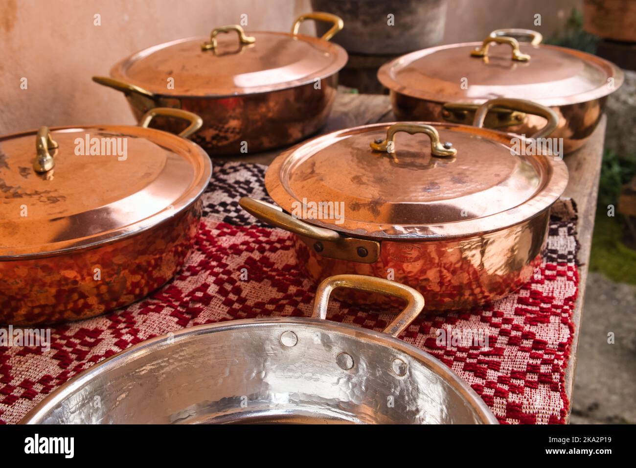 Close up of a set of copper pots handmade in Isili Stock Photo - Alamy