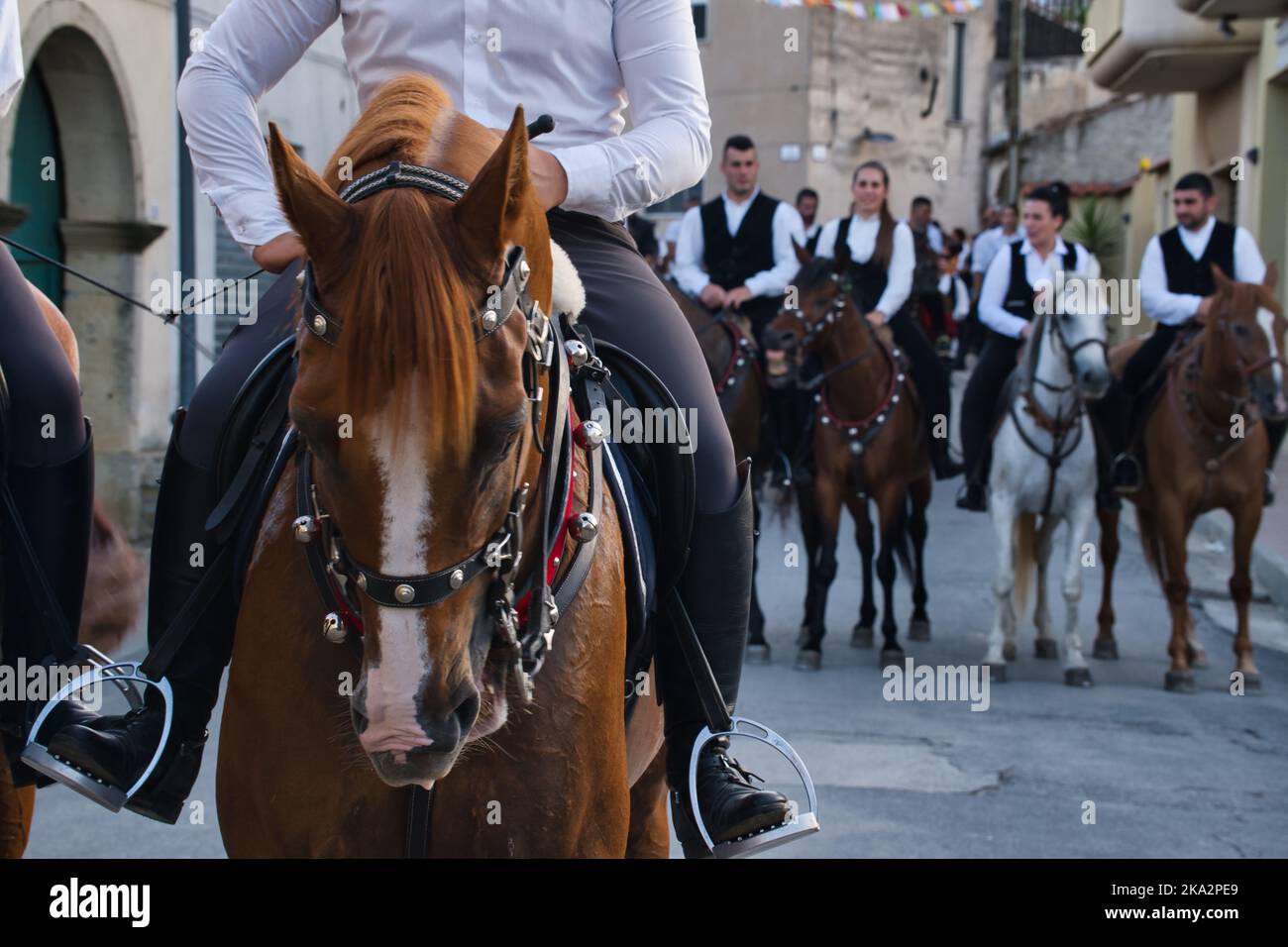Parade on horseback in traditional costume at the feast of the patron ...