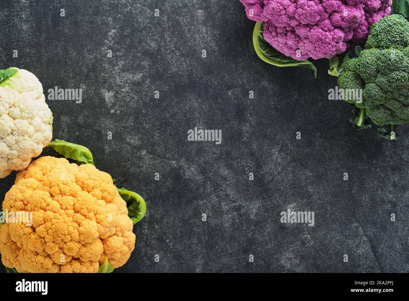 Colorful cauliflower. Various sort of cauliflower on old dark gray ...
