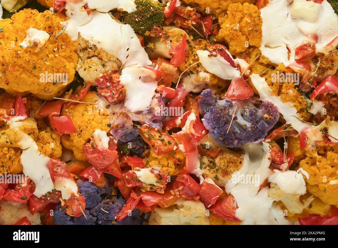 Baked colorful cauliflower. Cut into small pieces baked cauliflower ...