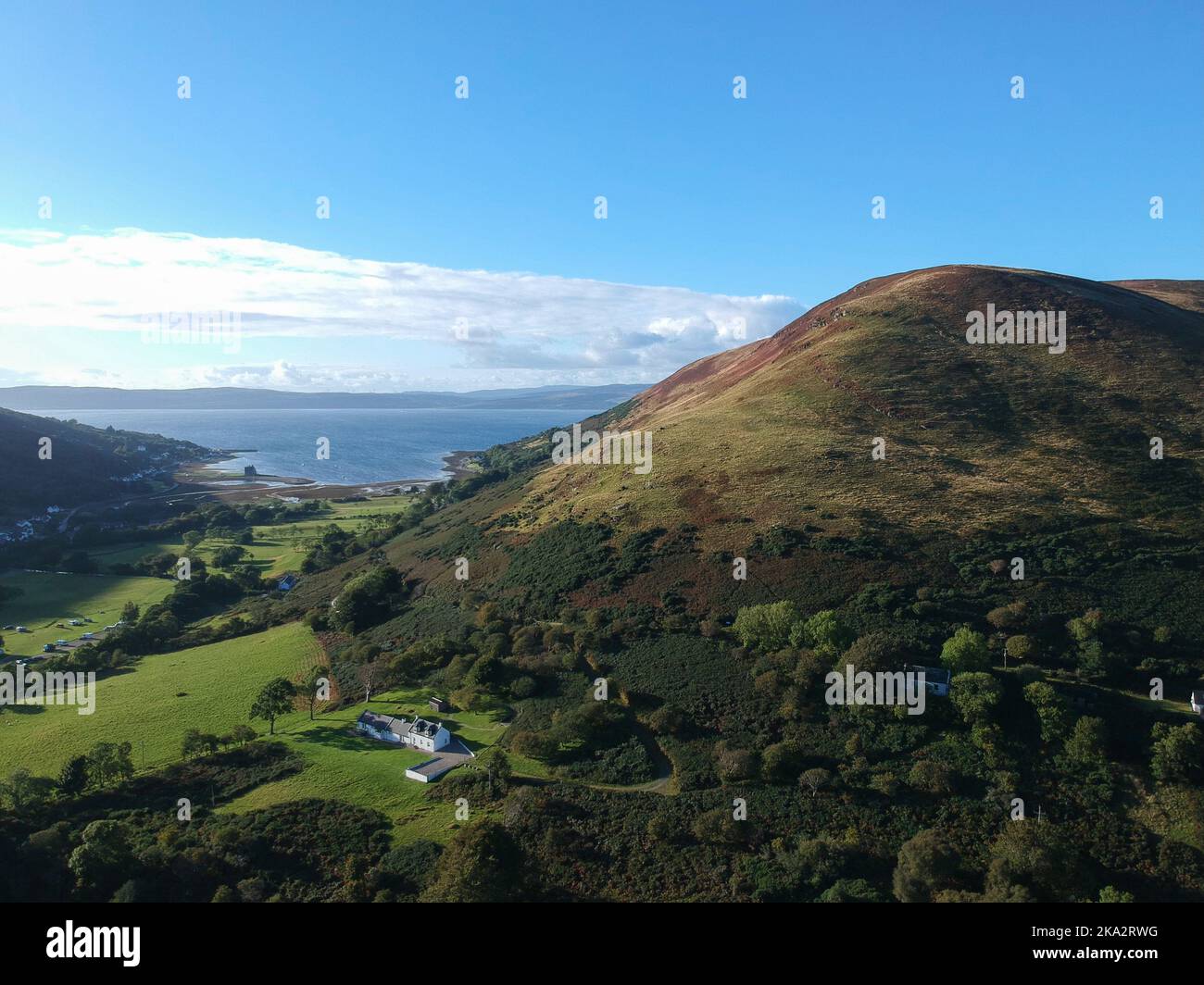 An aerial of the green mountains in the Isle of Arran, Scotland Stock ...