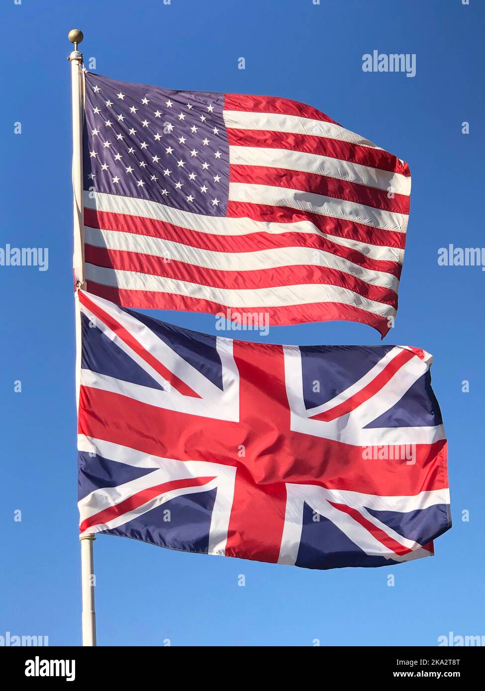 The American Flag and Union Flag on the same flag pole waving on the ...
