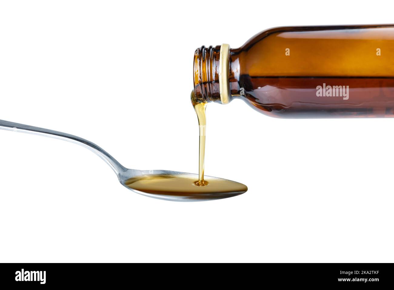 Pouring syrup medicine to spoon isolated over white background Stock ...