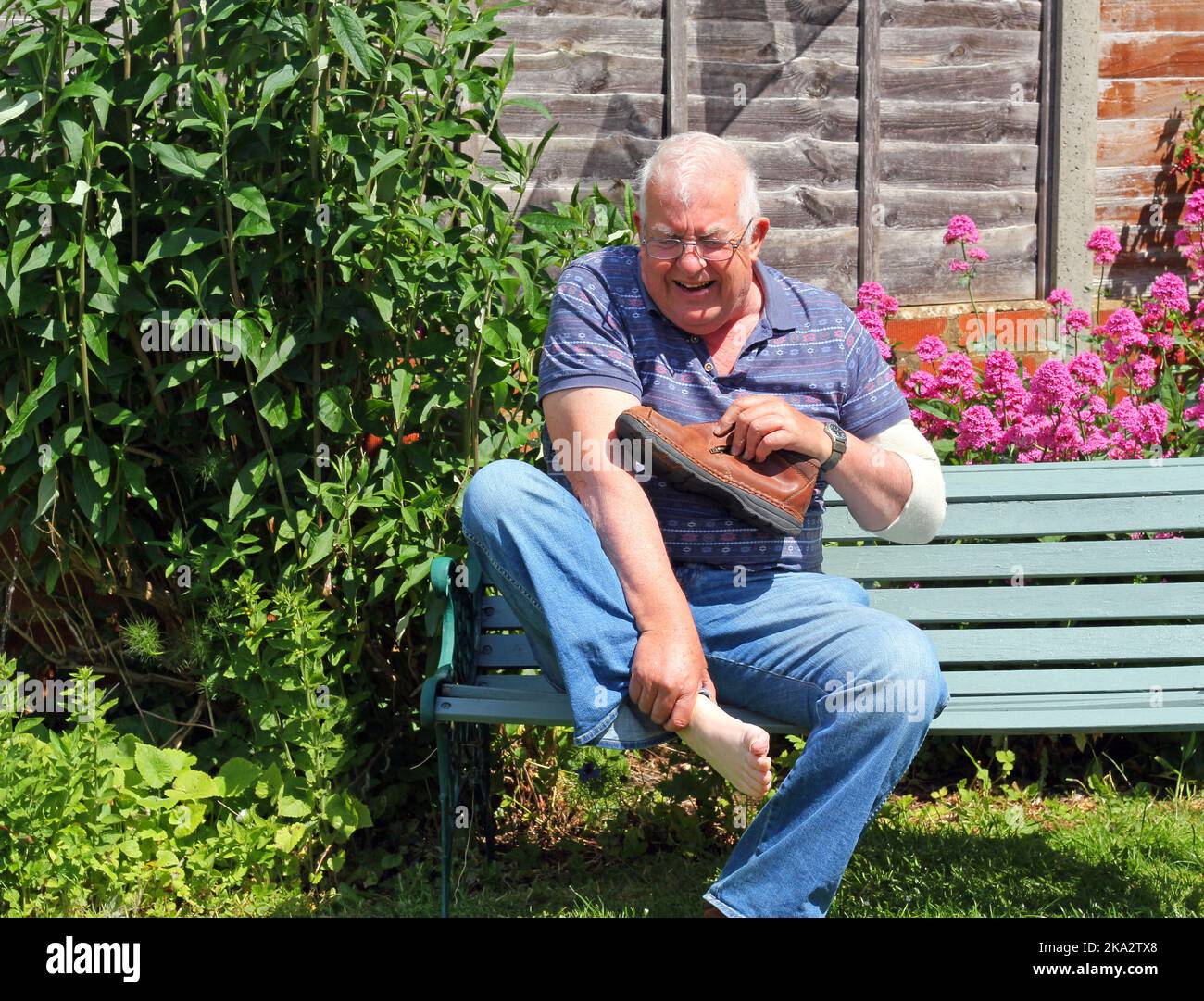 Elderly or old man with foot pain. Either injury by accident of ...