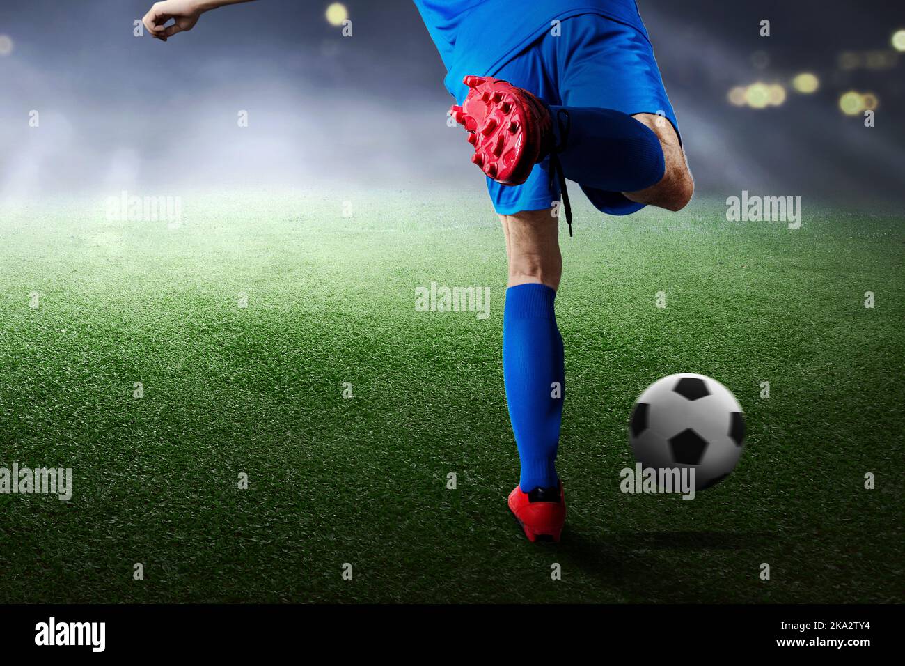 Rear view man kick ball hi-res stock photography and images - Alamy