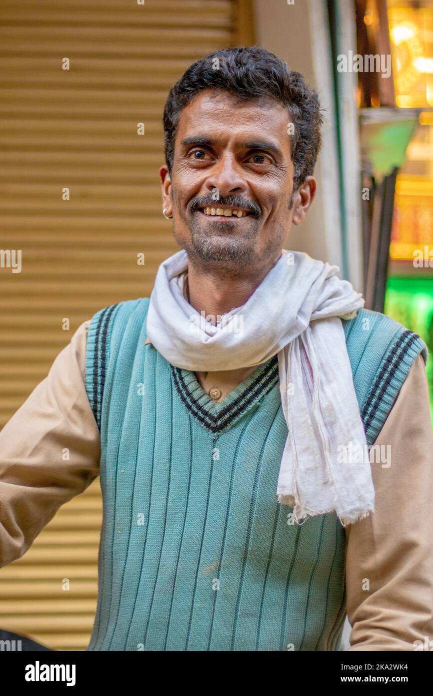 A vertical shot of a salesman at a local street market in India Stock ...
